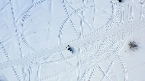 Top view of riding snowmobiles. Footage.... | Stock Video | Pond5