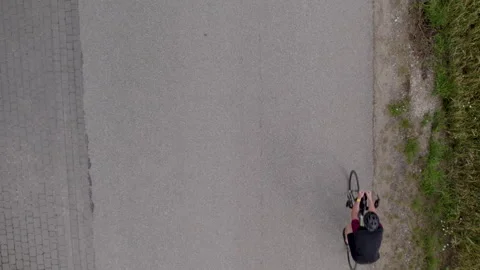 Top view showing man on racing bicycle r... | Stock Video | Pond5