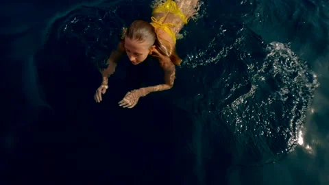 Top view on skinny woman in bikini float... | Stock Video | Pond5