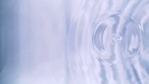 Top view slow motion of drop falling int... | Stock Video | Pond5