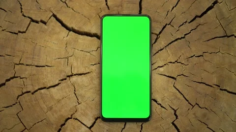 Top view, Smart phone place on a tree cu... | Stock Video | Pond5