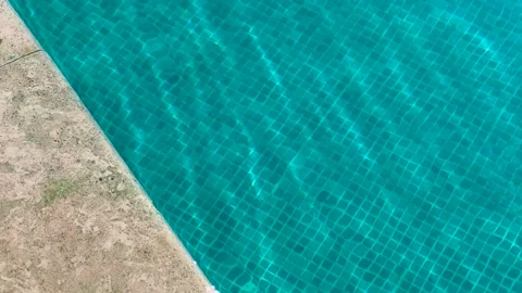 Top view swimming pool edge, blue water ... | Stock Video | Pond5