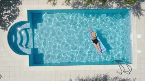 Top view swimming pool with relaxing wom... | Stock Video | Pond5