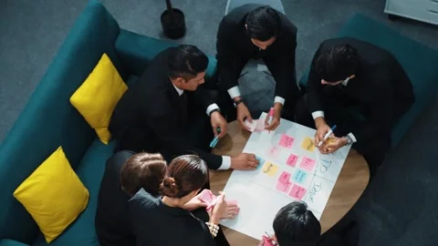 Top view of team write plan and putting ... | Stock Video | Pond5