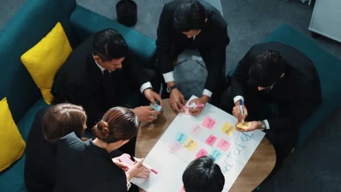 Top view of team write plan and putting ... | Stock Video | Pond5