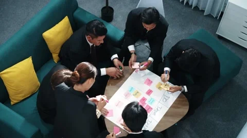 Top view of team write plan and putting ... | Stock Video | Pond5