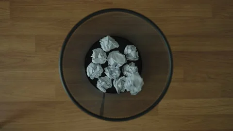 Top view of throwing crumpled paper into... | Stock Video | Pond5