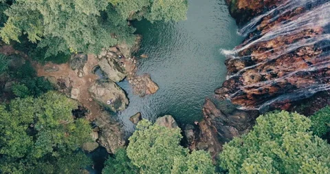 Top view of a tropical waterfall from dr... | Stock Video | Pond5