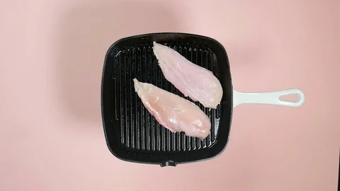 Top view turning over chicken breast fil... | Stock Video | Pond5