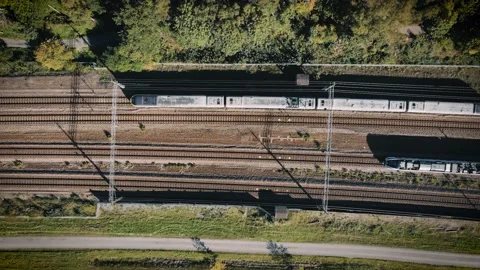 Top view of two trains passing by on on ... | Stock Video | Pond5