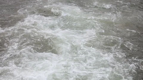 Top view of water flow under river dam. ... | Stock Video | Pond5
