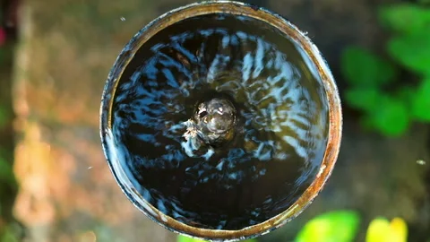 Top view of water leaking from a tap int... | Stock Video | Pond5