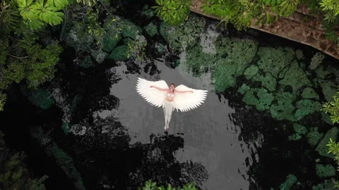 Top view of woman floating on the angel ... | Stock Video | Pond5