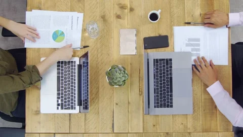 Top View of Woman Giving Man Paperwork i... | Stock Video | Pond5