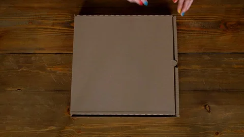 top view - woman opening box with of 4 c... | Stock Video | Pond5