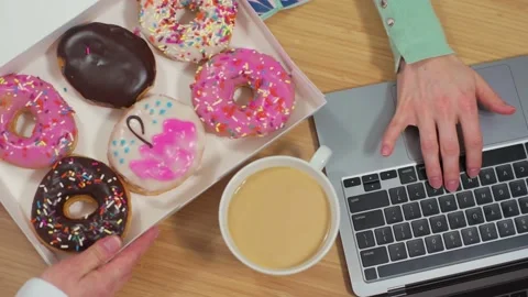 Top view like a woman taking donuts out ... | Stock Video | Pond5