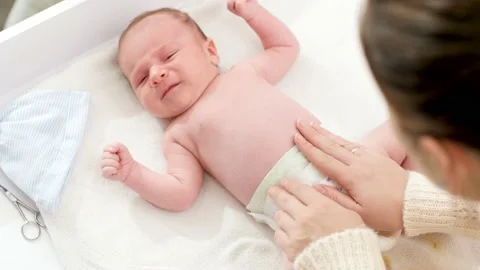 Top view of young caring mother changing... | Stock Video | Pond5