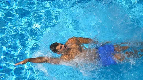 Top view of young sporty guy floating ac... | Stock Video | Pond5