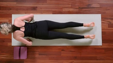 Top view of young woman doing Yoga exerc... | Stock Video | Pond5