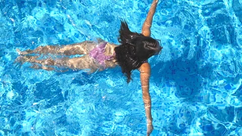 Top view of young woman in pink bikini s... | Stock Video | Pond5