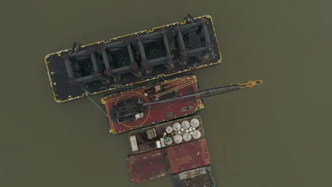 Topdown Rotating Aerial Above a Crane Ba... | Stock Video | Pond5