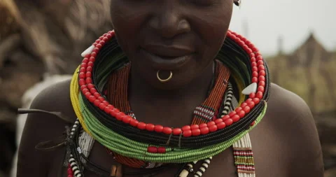Toposa tribe woman in traditional clothi... | Stock Video | Pond5