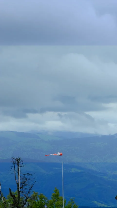torn windsock with storm on the mountain... | Stock Video | Pond5