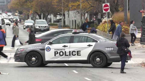 Toronto police car blocks road in city d... | Stock Video | Pond5