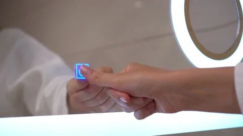 Touching glow button on mirror display w... | Stock Video | Pond5