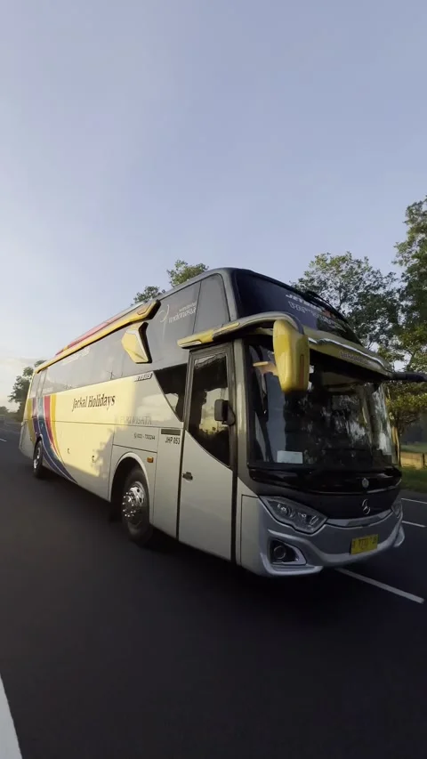 Tour bus driving on highway in West Java... | Stock Video | Pond5