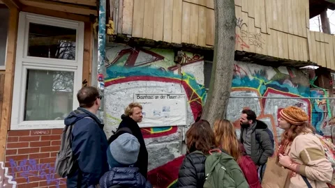 Tour Guide Explaining History Behind Bau... | Stock Video | Pond5