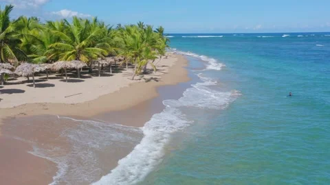 Tourist bathing at Nagua beach, Dominica... | Stock Video | Pond5
