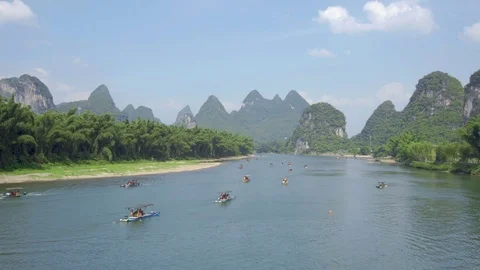 Tourist motorized rafts on the Li River.... | Stock Video | Pond5