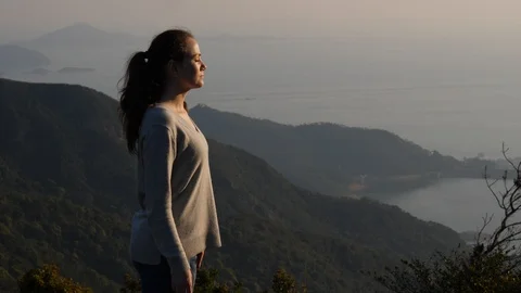 Tourist woman stay face to sunset, eyes ... | Stock Video | Pond5