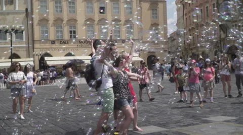 Tourists enjoying Flying soap bubbles in... | Stock Video | Pond5
