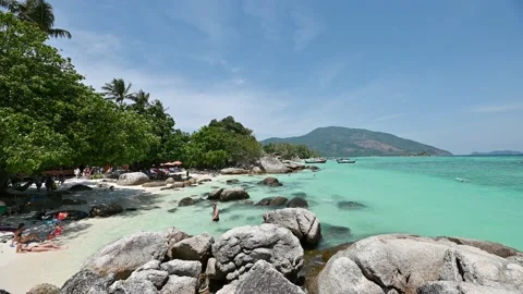 Tourists relaxing on the beach in Andama... | Stock Video | Pond5