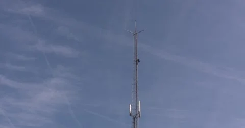 Tower climber in a cell tower, working a... | Stock Video | Pond5