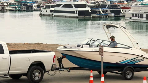 Towing a boat. Lake Powell beach. | Stock Video | Pond5