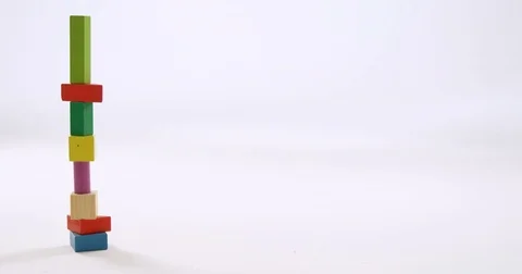Toy blocks falling on white background 4... | Stock Video | Pond5