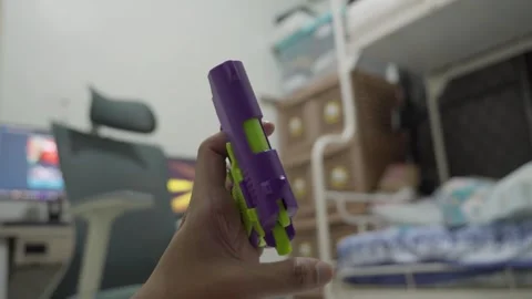 Toy gun with realistic muzzle flash effe... | Stock Video | Pond5