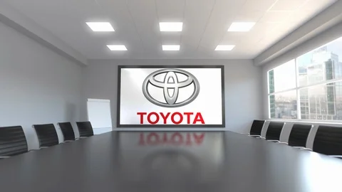 Toyota logo on the screen in a meeting r... | Stock Video | Pond5
