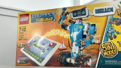 Toys for kids. LEGO BOOST teaching kids ... | Stock Video | Pond5