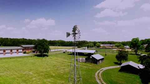 tracking around old country windmill on ... | Stock Video | Pond5