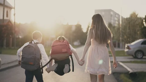 Tracking, Back view shot: Young mother g... | Stock Video | Pond5