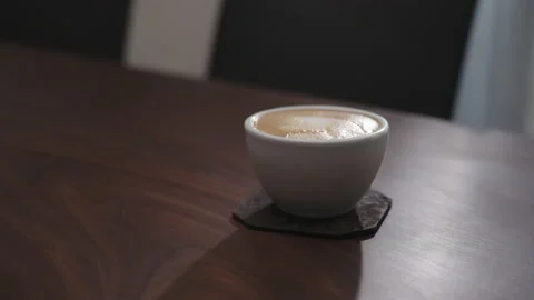 Tracking dolly shot of cappuccino in whi... | Stock Video | Pond5
