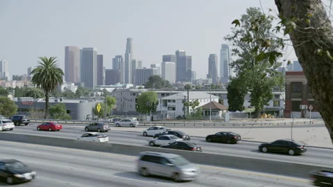Tracking left shot of Highway with Downt... | Stock Video | Pond5
