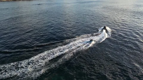 Tracking Shot Of Jet Ski Carrying People... | Stock Video | Pond5