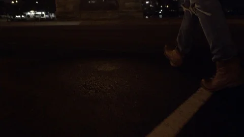 Tracking Shot of Man's Legs Walking Acro... | Stock Video | Pond5