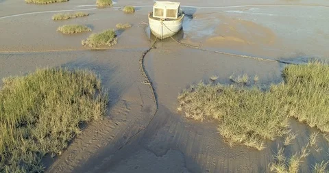 Tracking Shot of a Small Sunken Boat in ... | Stock Video | Pond5