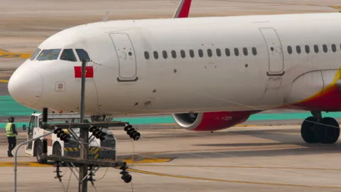 Tractor and passenger board, airport | Stock Video | Pond5